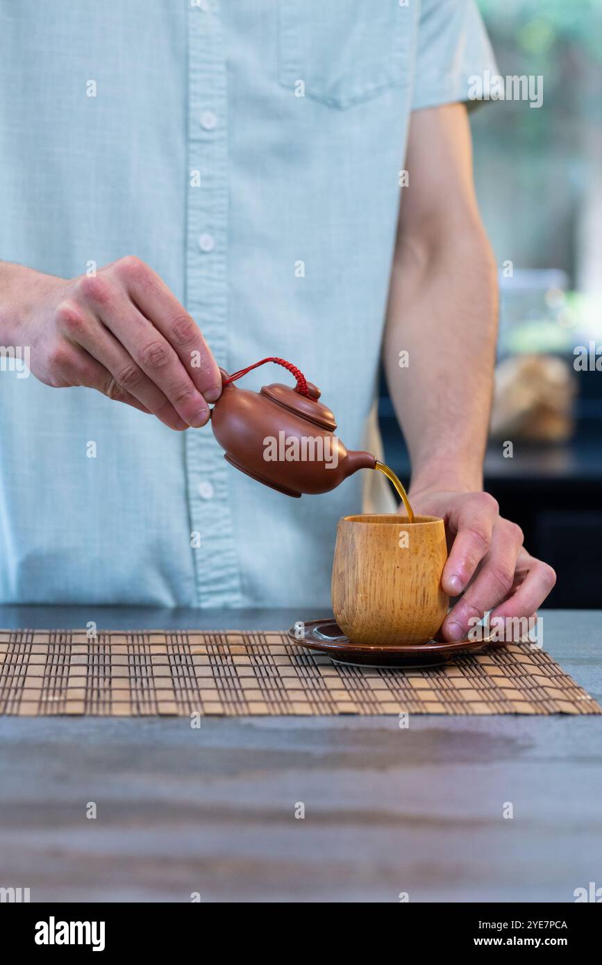 Tea pouring into cup hi-res stock photography and images - Alamy