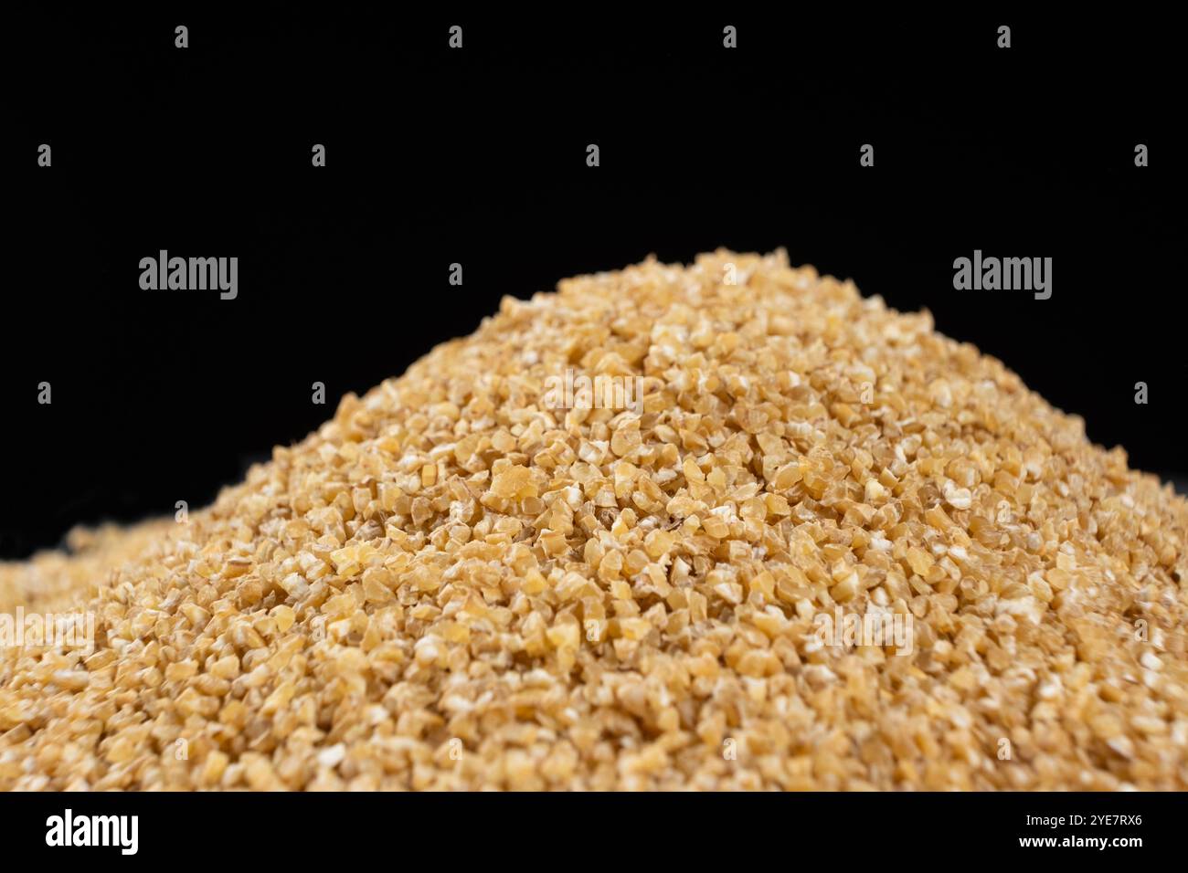 Pile of raw uncooked wheat groats on a black background Stock Photo - Alamy