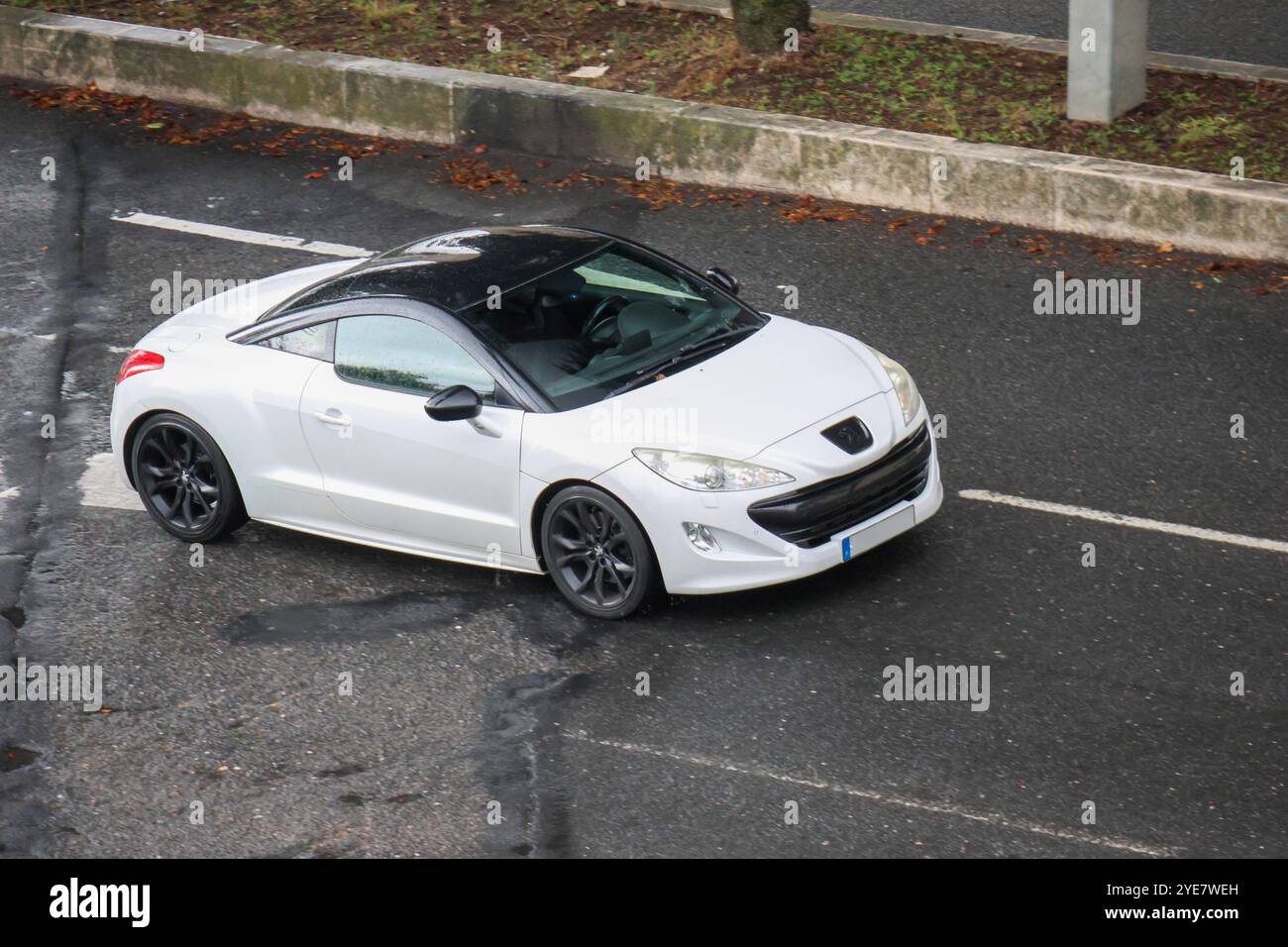 White peugeot rcz with black roof is standing on an asphalt road Stock ...