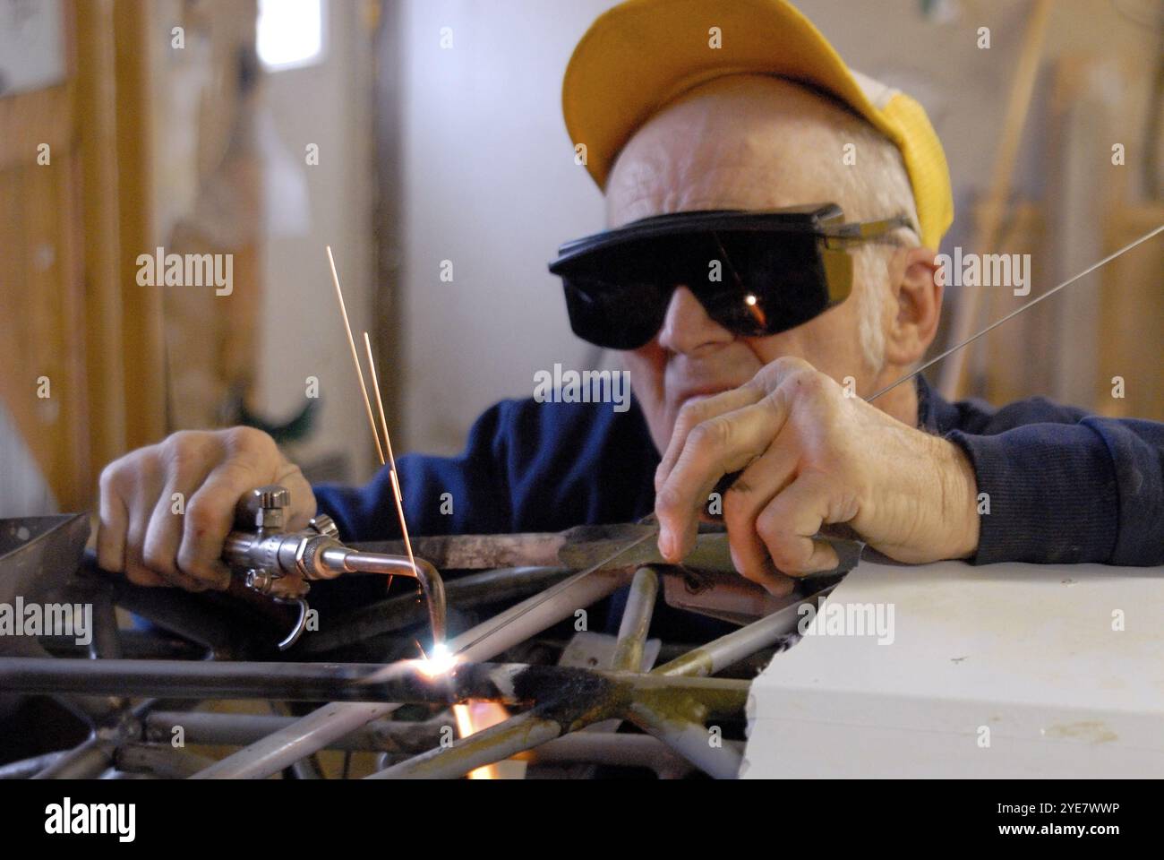 Welder, welding, connecting, old worker, working into old age, man ...