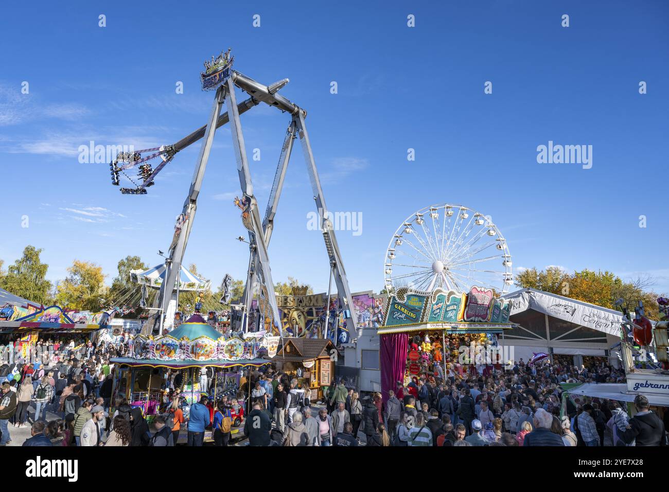 Crowd of people on fairground, amusement park, amusement ride, Ferris ...