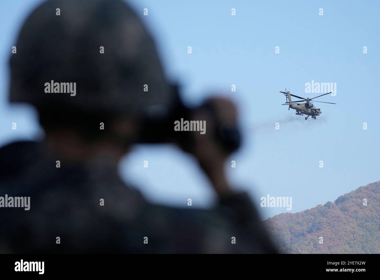 A South Korean army AH-64E Apache helicopter fires during a combined ...