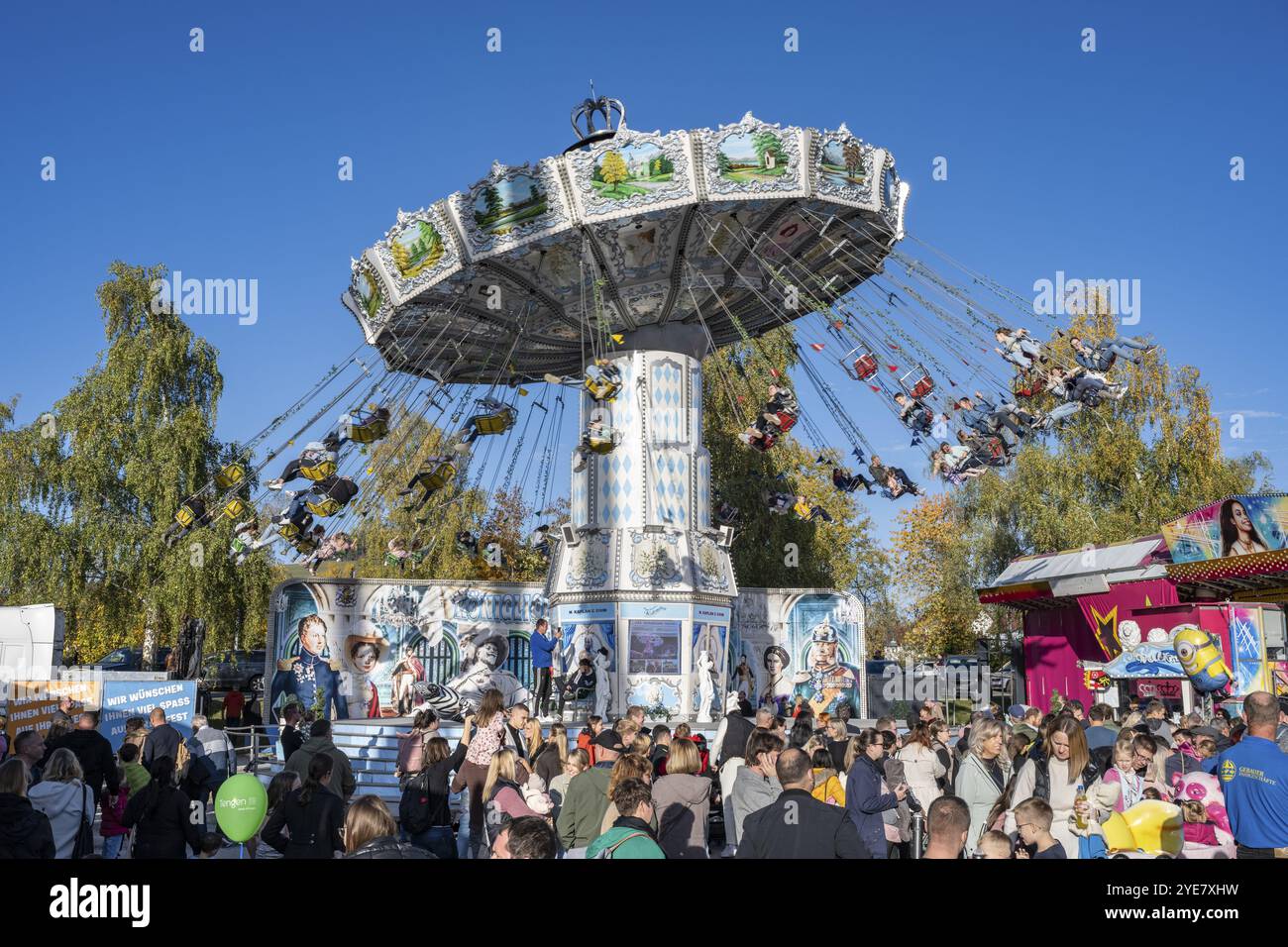 Crowd of people on fairground, amusement park, amusement ride, chain ...