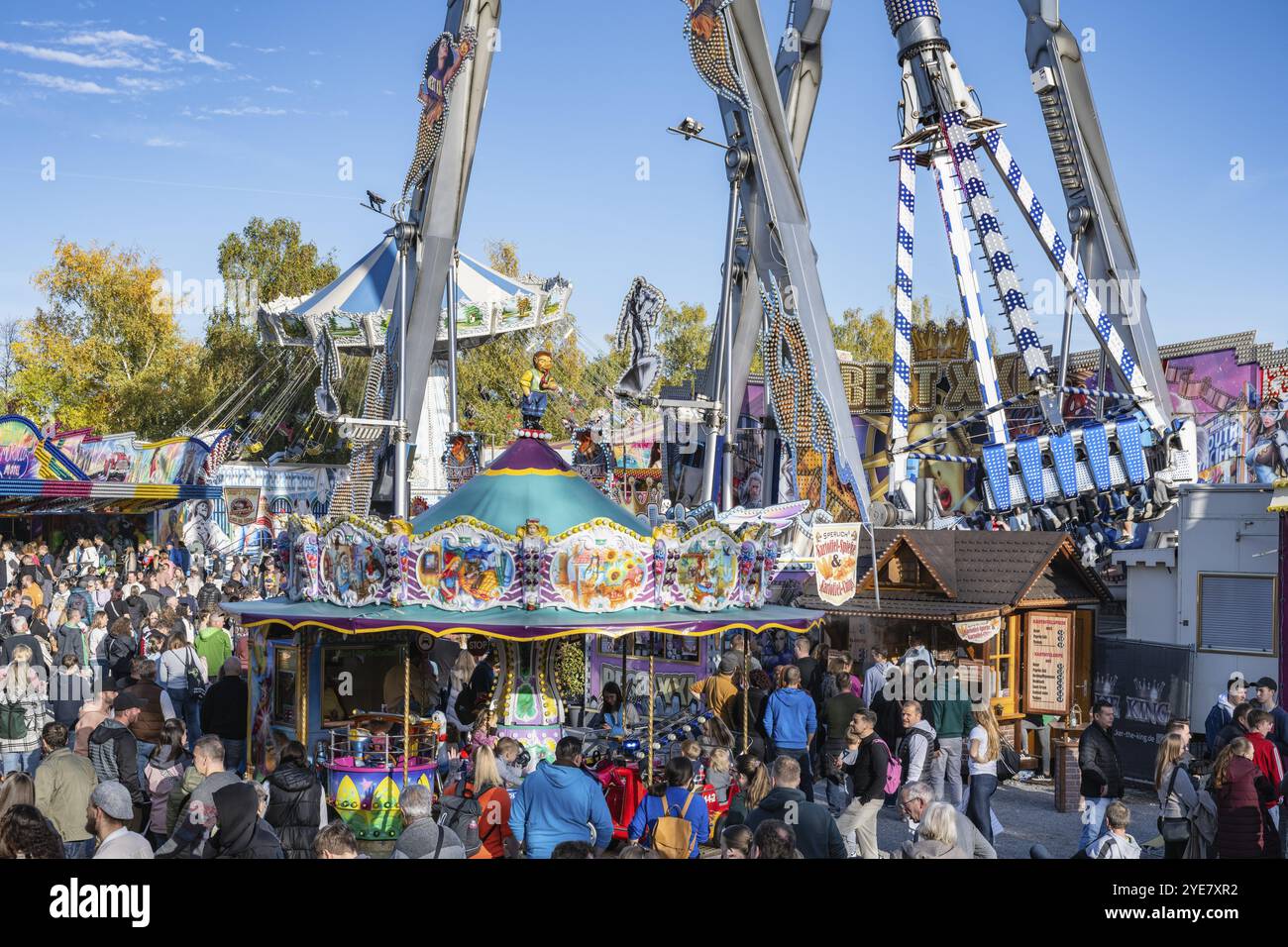 Crowd of people on fairground, amusement park, ride, carousel, showman ...
