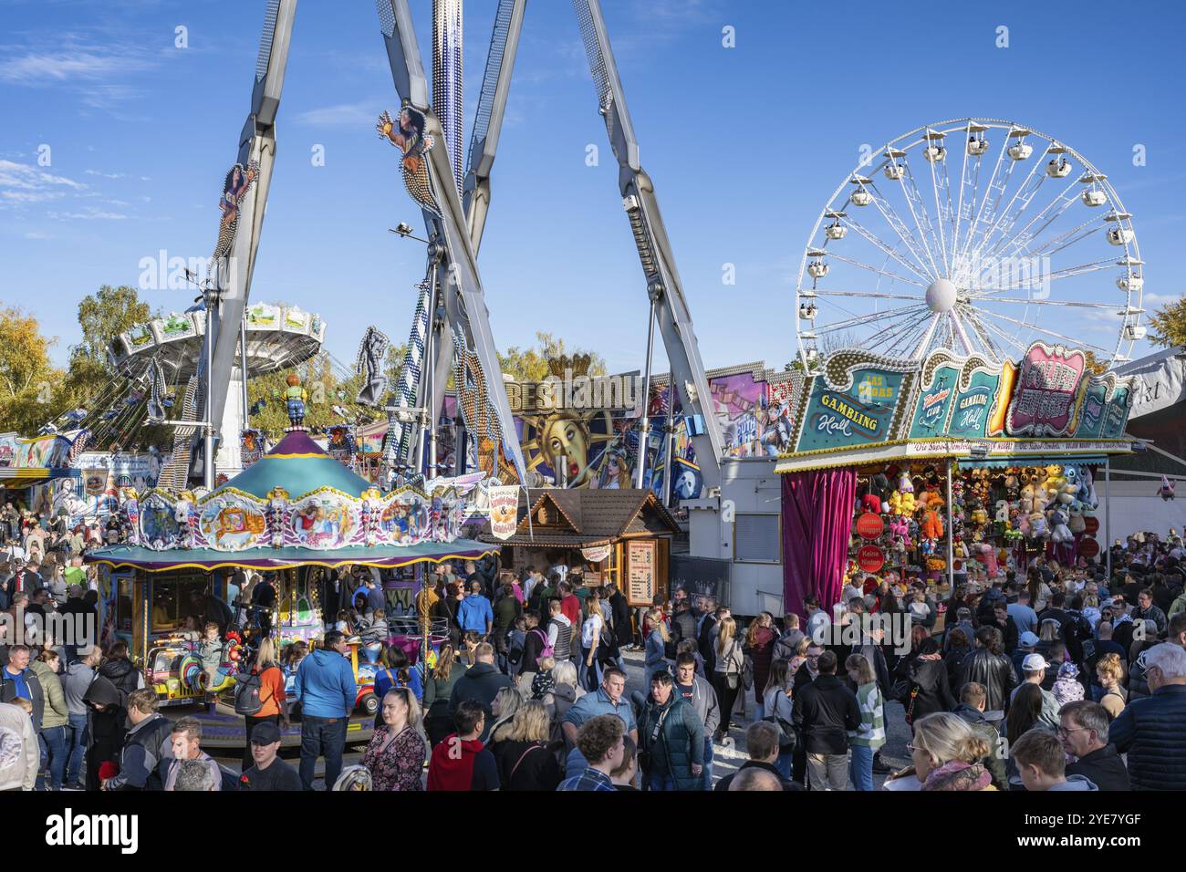 Crowd of people on fairground, amusement park, amusement ride, Ferris ...