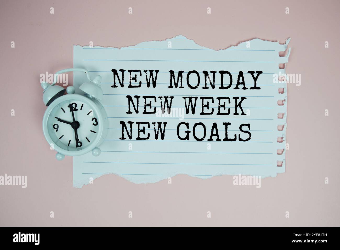 New Monday New Week New Goals text motivational and inspiration quote with alarm clock on pink ...