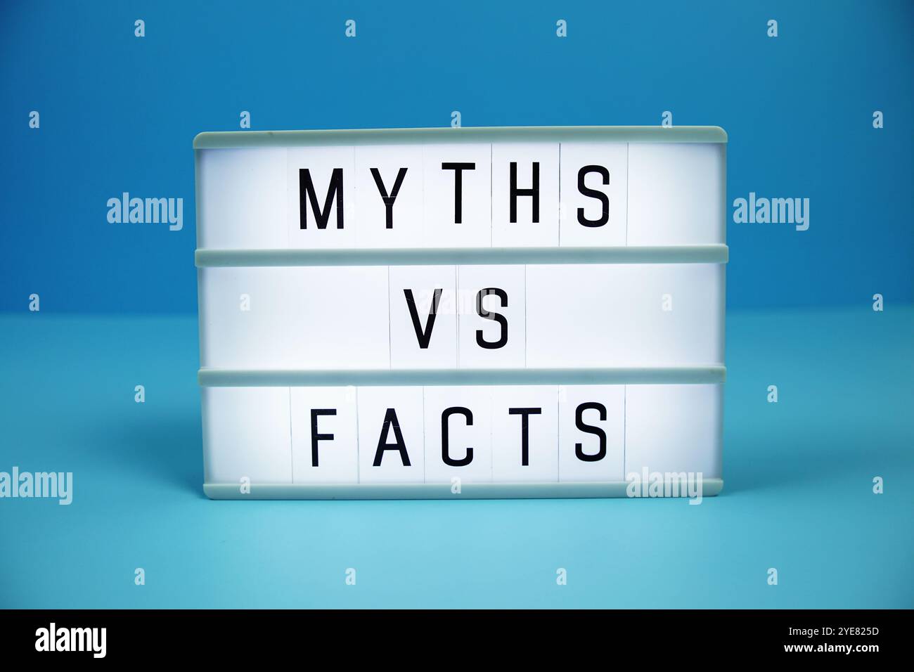 Myths vs Facts letterboard text on LED Lightbox on blue background ...