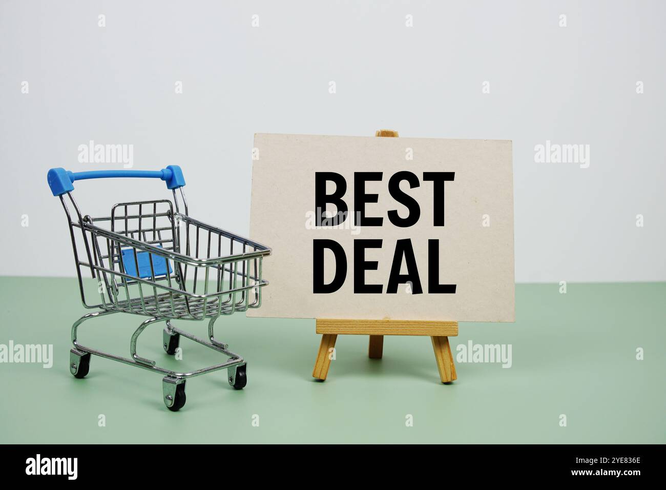 Best Deal text message and trolley shopping cart on green background ...