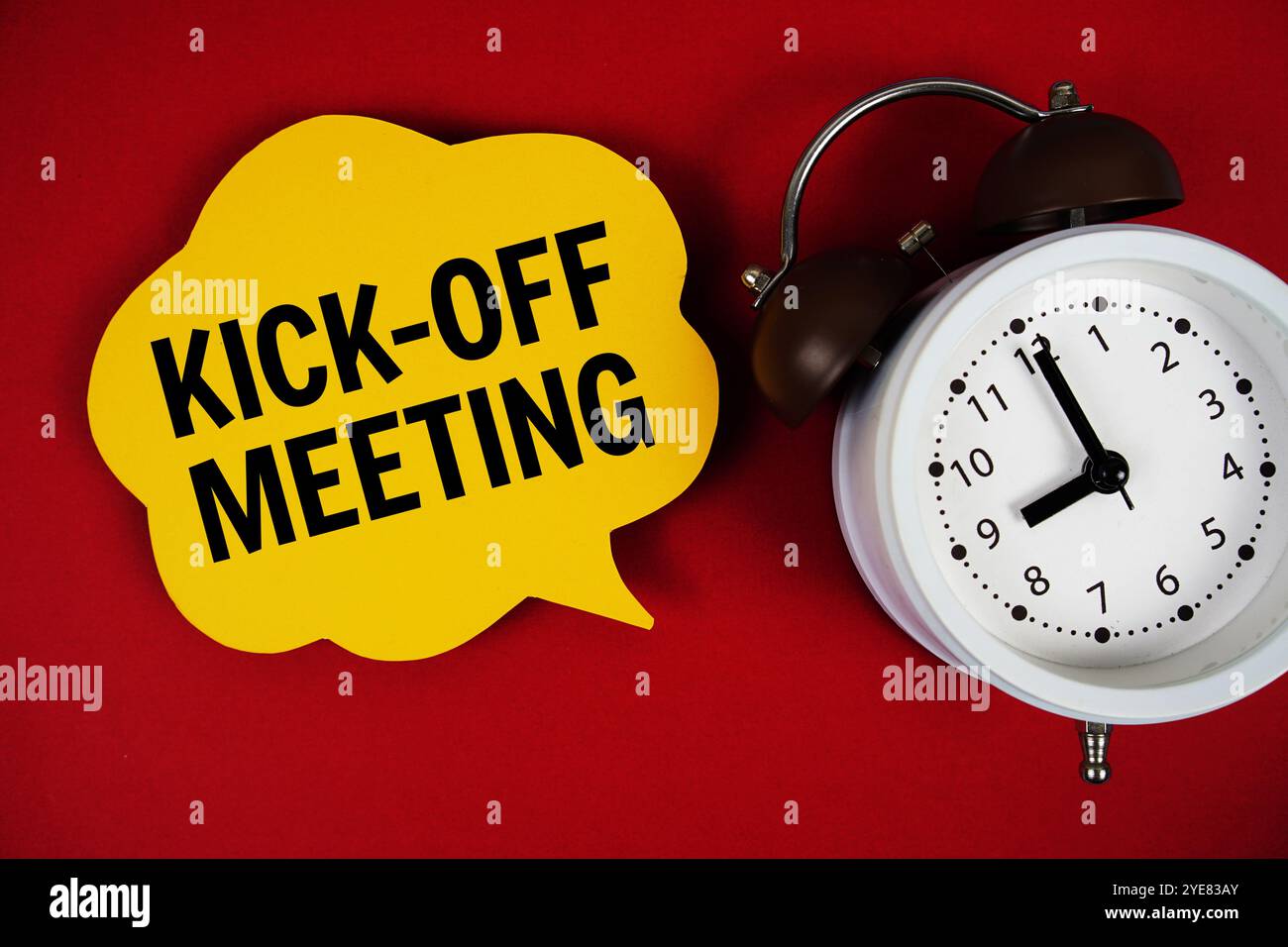 Kick-Off Meeting text on speech bubble with alarm clock on red ...