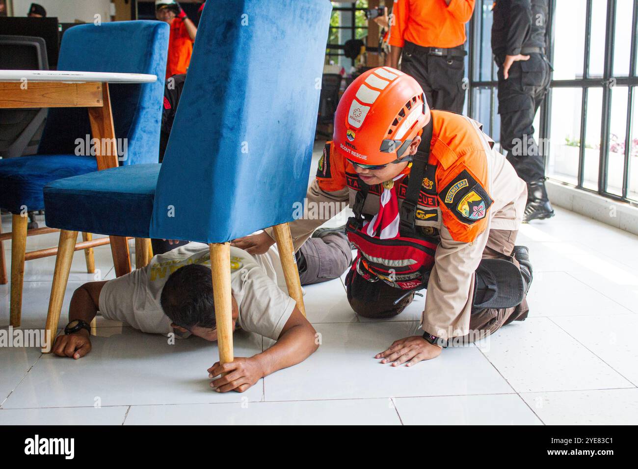 Joint officers attend to a man roleplaying as an injured victim during ...