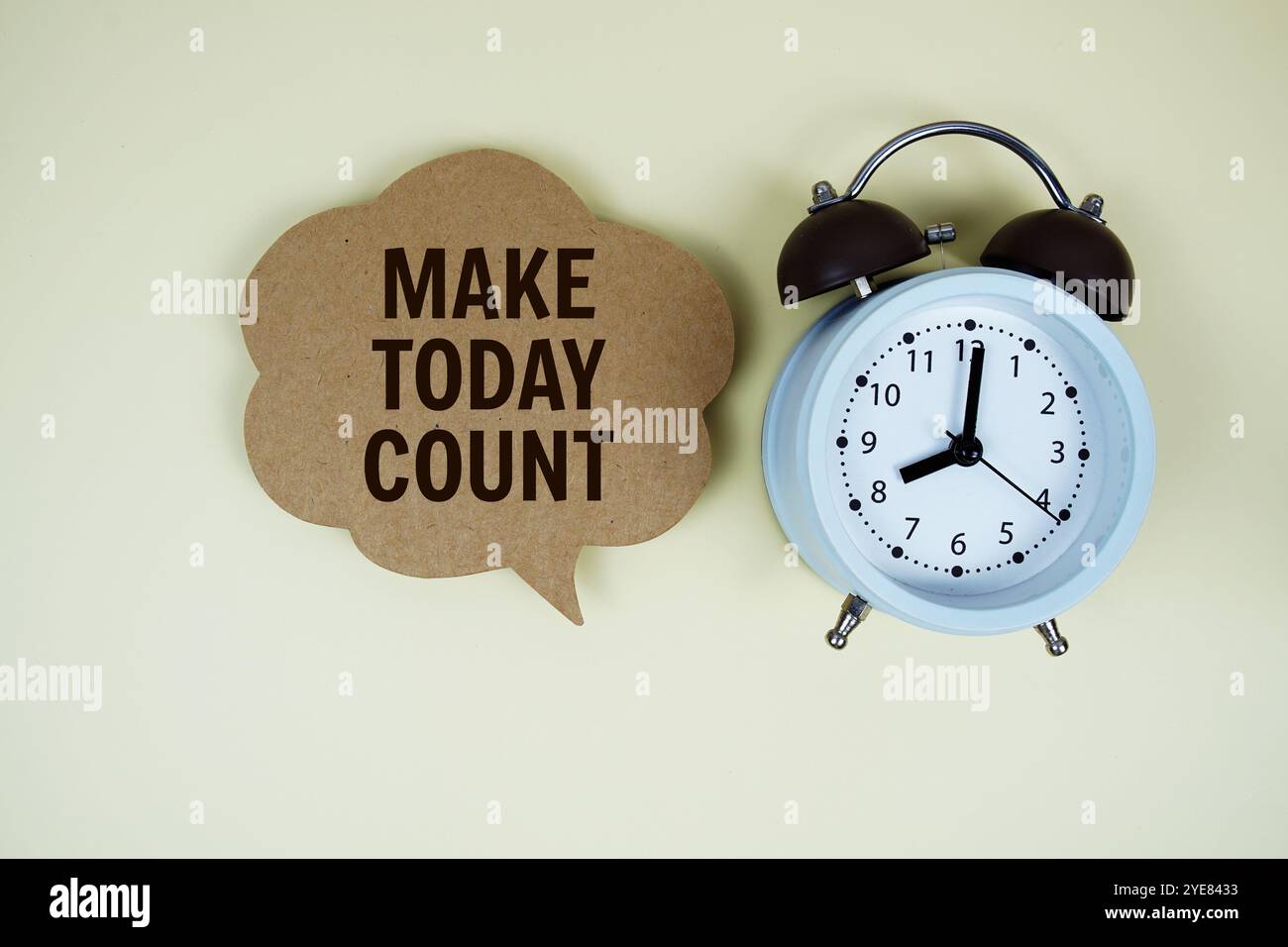 Make Today Count text on speech bubble with alarm clock on yellow ...