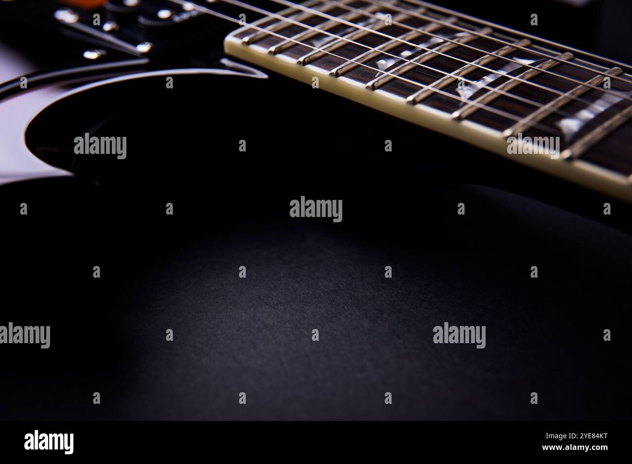 Fretboard of modern electric guitar. Close up Stock Photo - Alamy