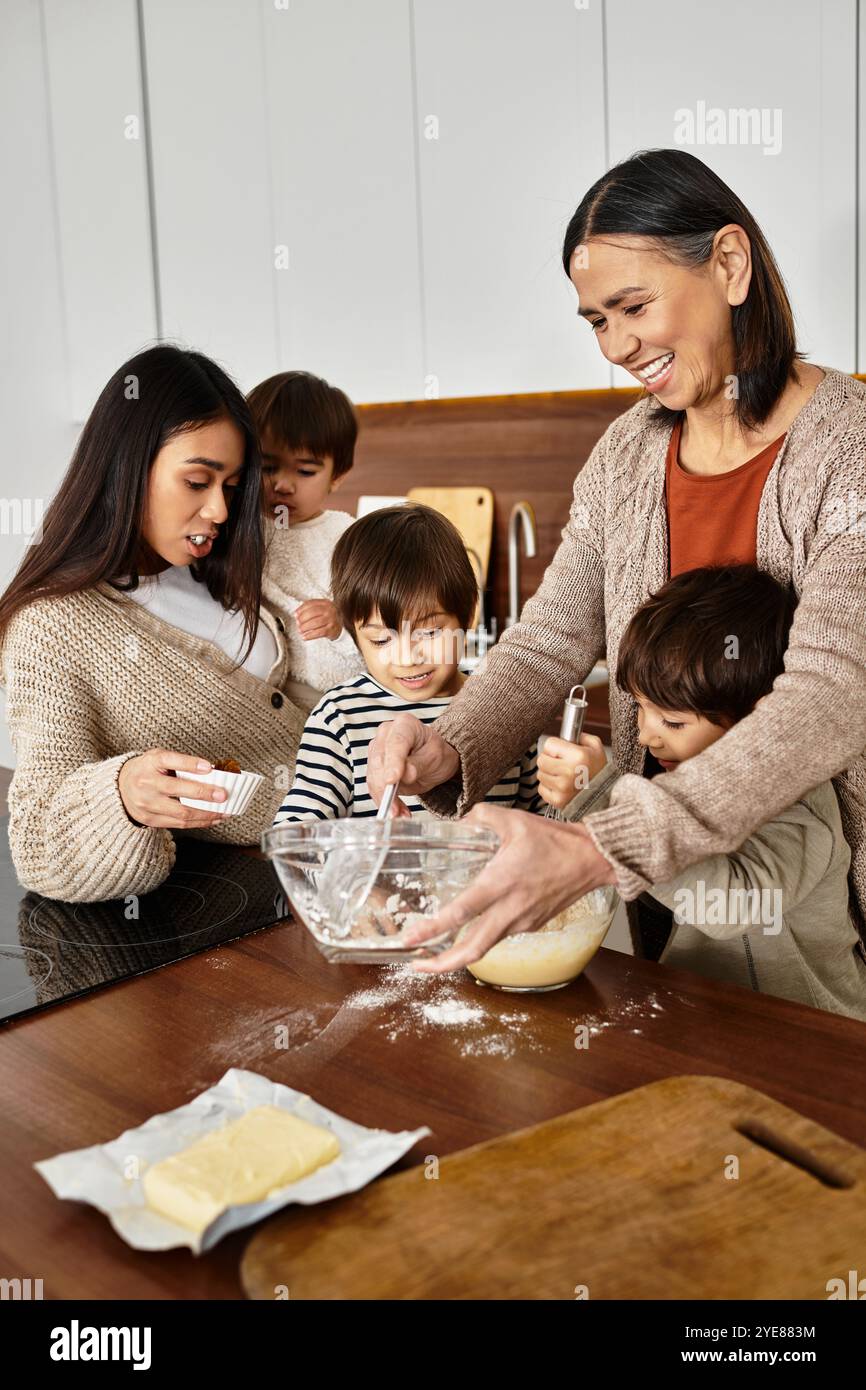 A happy Asian family enjoys baking together in a cozy kitchen ahead of ...