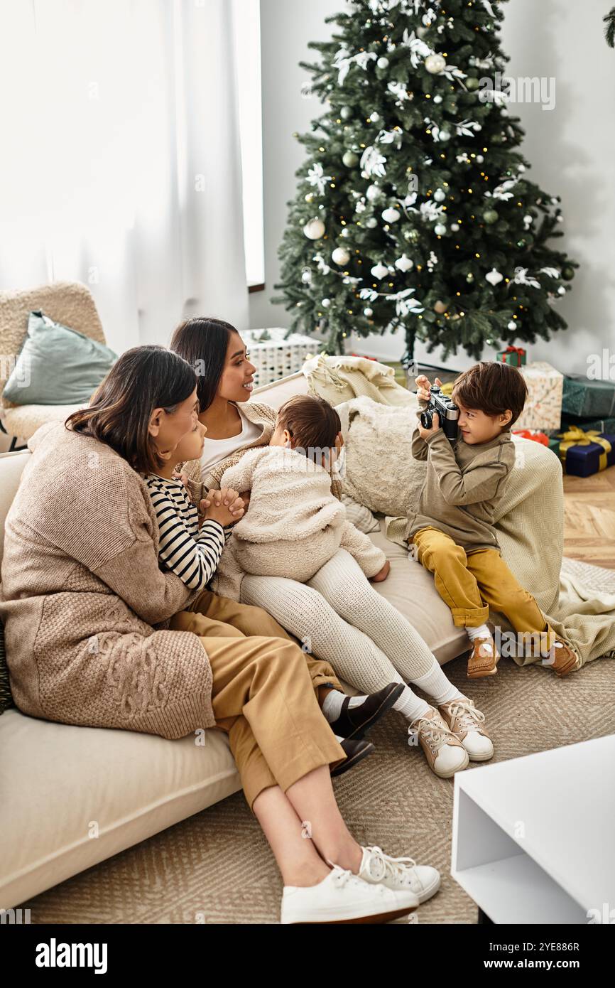 A happy family enjoys Christmas by the tree, sharing smiles and ...