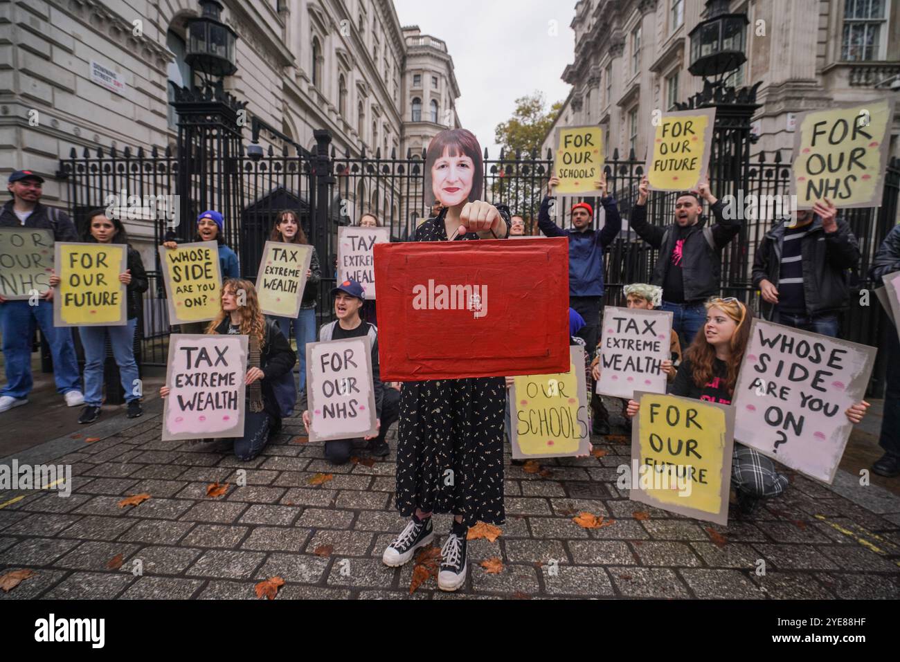 London, UK. 30 October 2024 Protesters hold placards as they ...