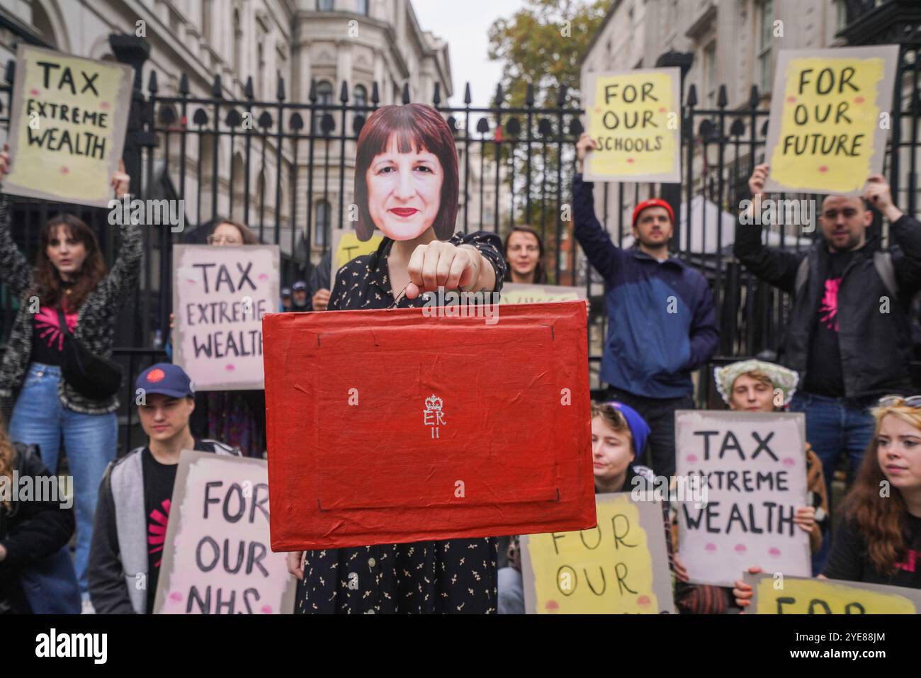 London, UK. 30 October 2024 Protesters hold placards as they ...