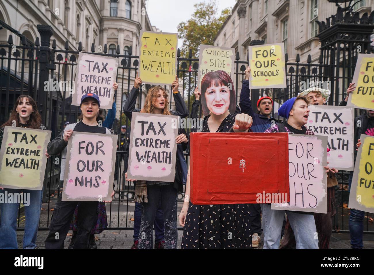 London, UK. 30 October 2024 Protesters hold placards as they ...