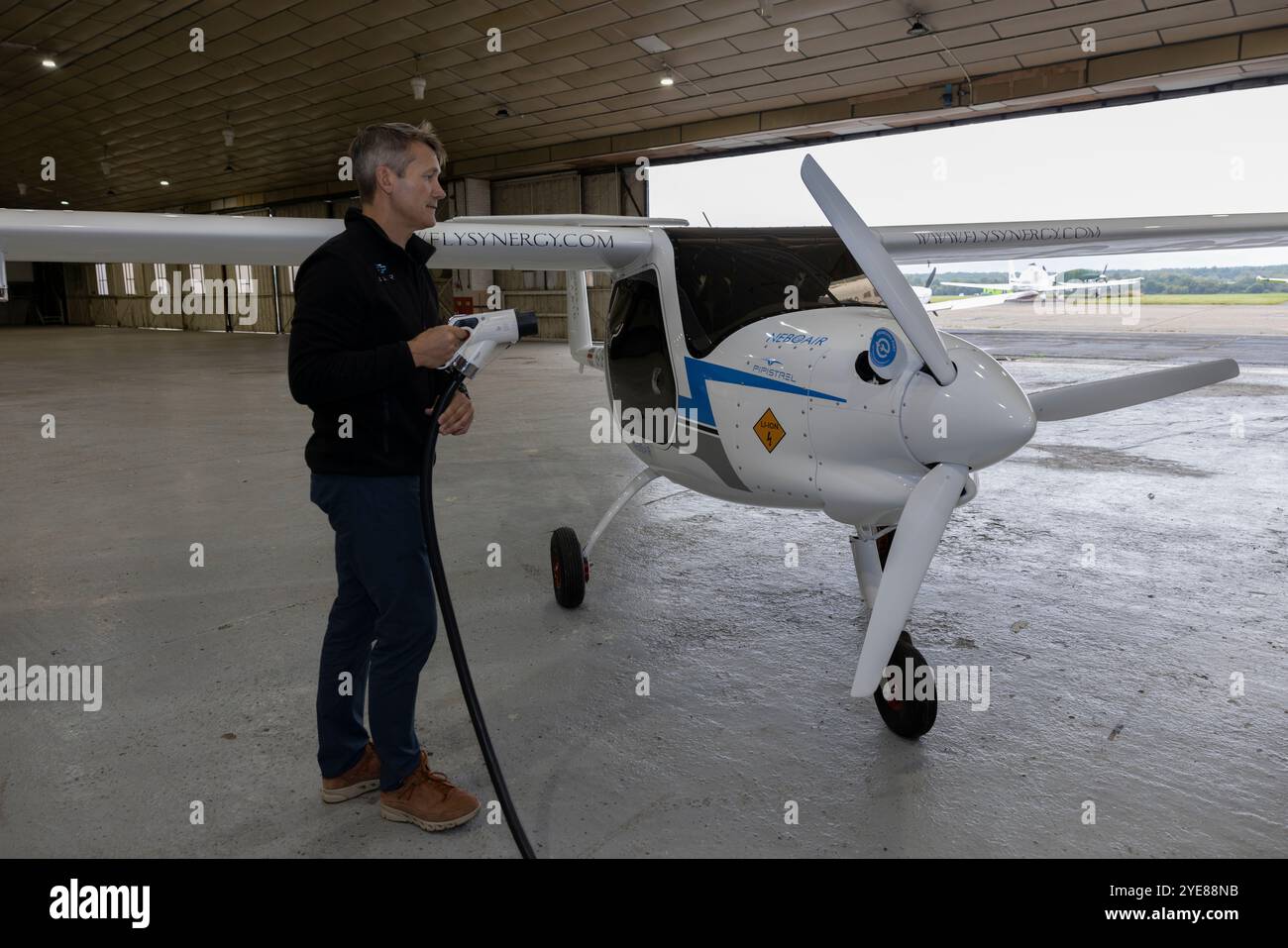 Former RAF pilot Adam Twidell with the Pipistrel Velis Electro Britain ...