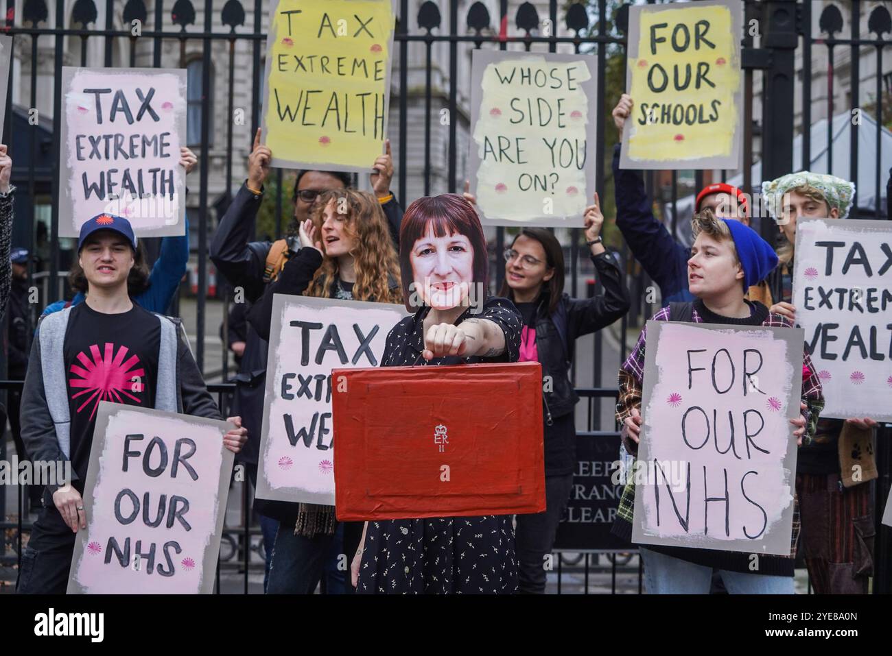 London, UK. 30 October 2024 Protesters hold placards as they ...
