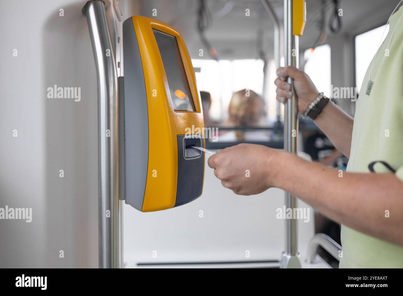Yellow ticket validation machine on a modern public transport bus ...