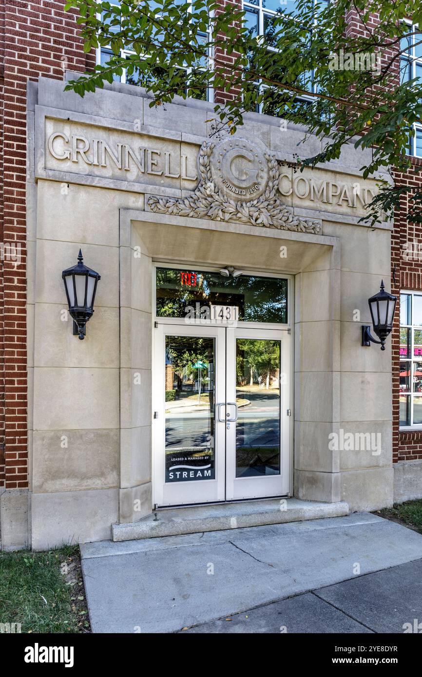 Charlotte, NC, USA-Oct. 20, 2024:Entrance doors and engraved sign of ...