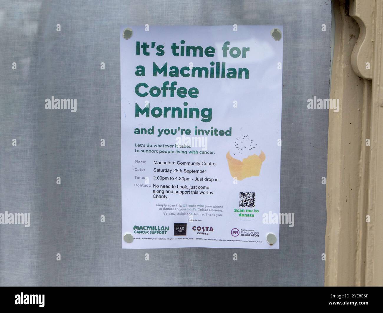 Notice in a window for a Macmillan Coffee Morning raising funds for the ...