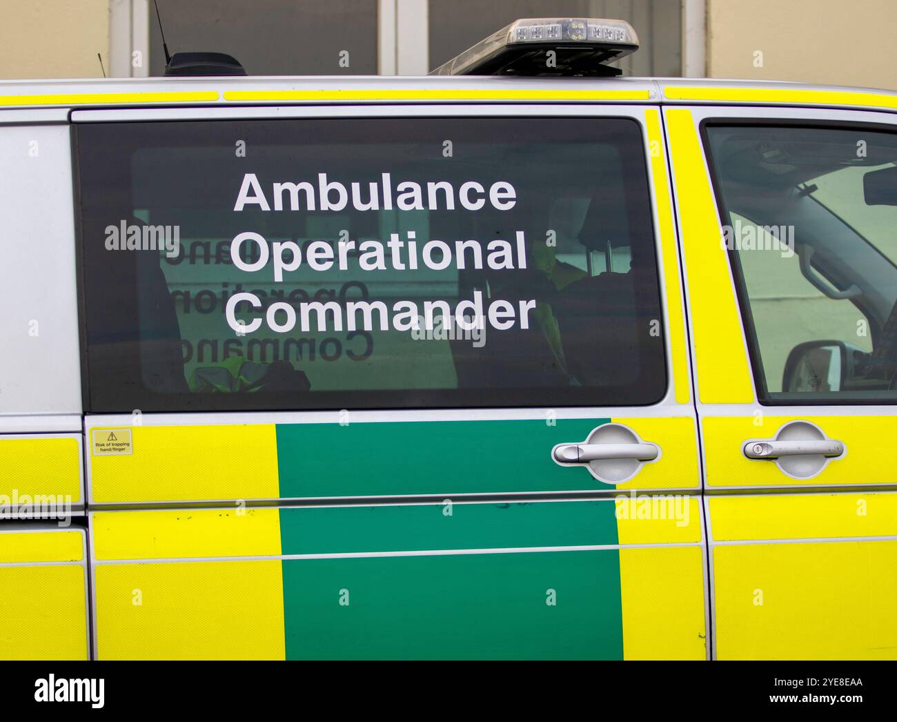 Ambulance vehicle in high visibility green and yellow marked 'Ambulance ...