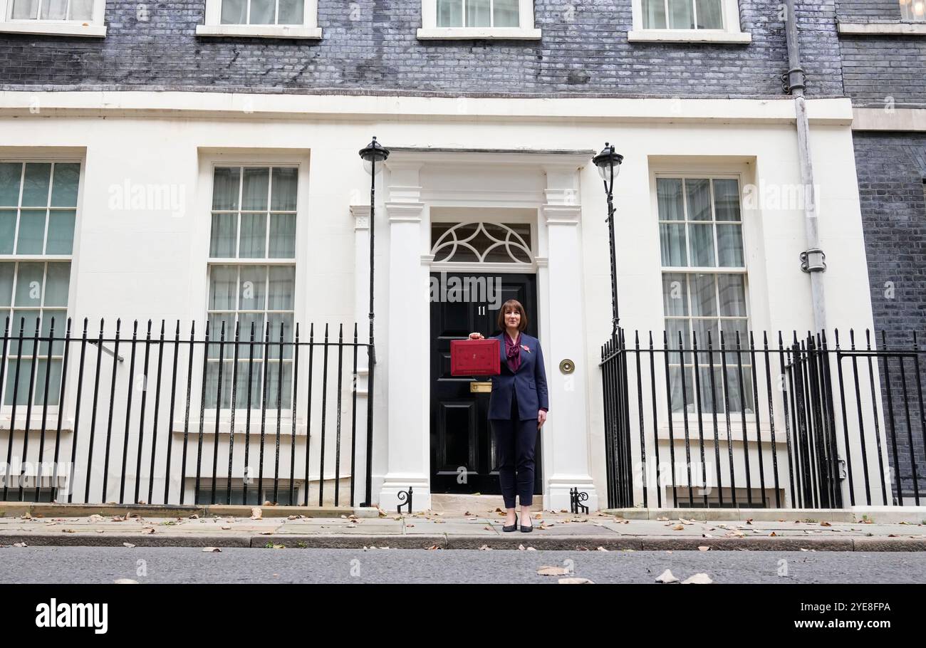 Britain's Chancellor of the Exchequer, Rachel Reeves, holds up the ...
