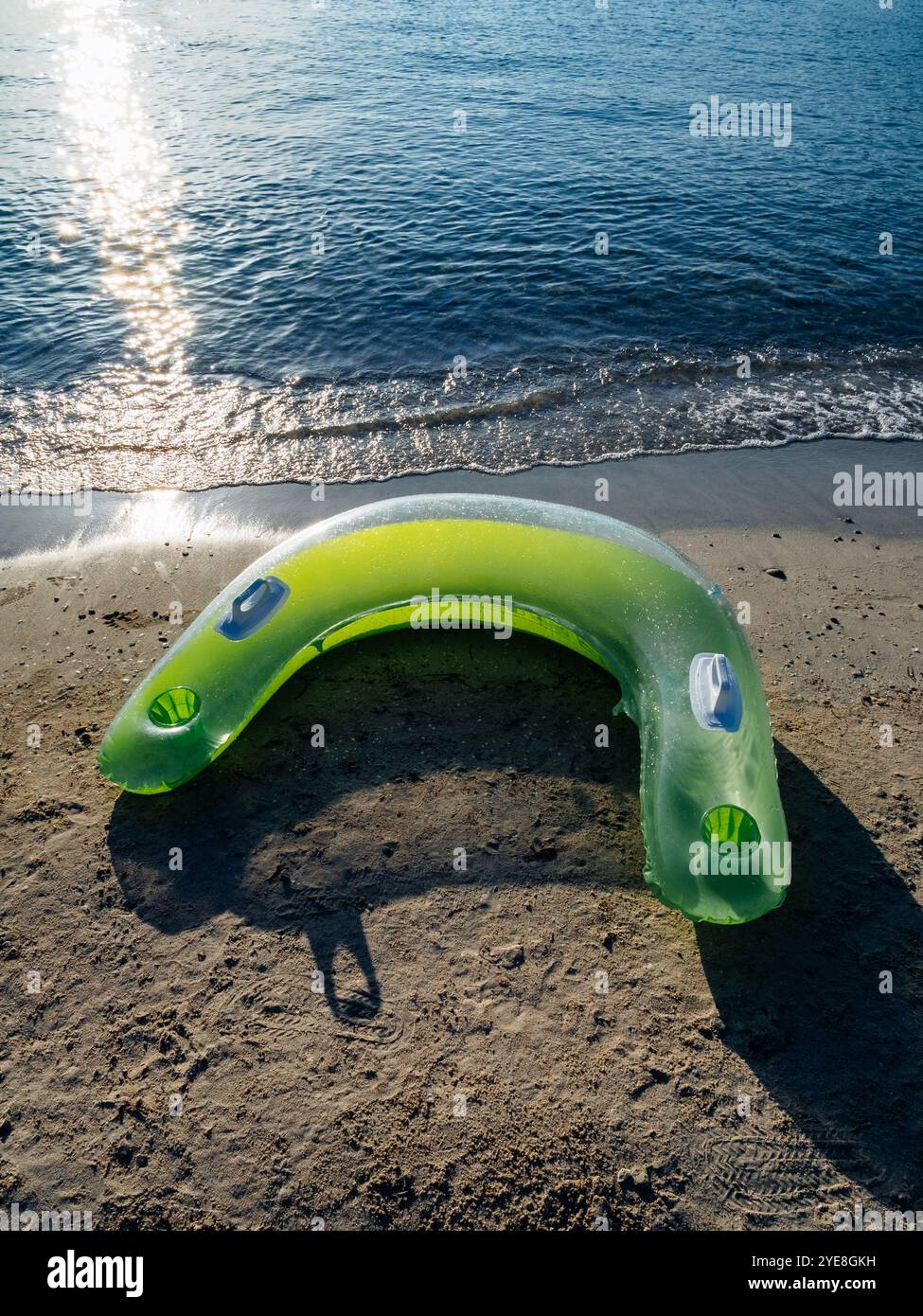 U shaped inflatable on beach shore Stock Photo - Alamy