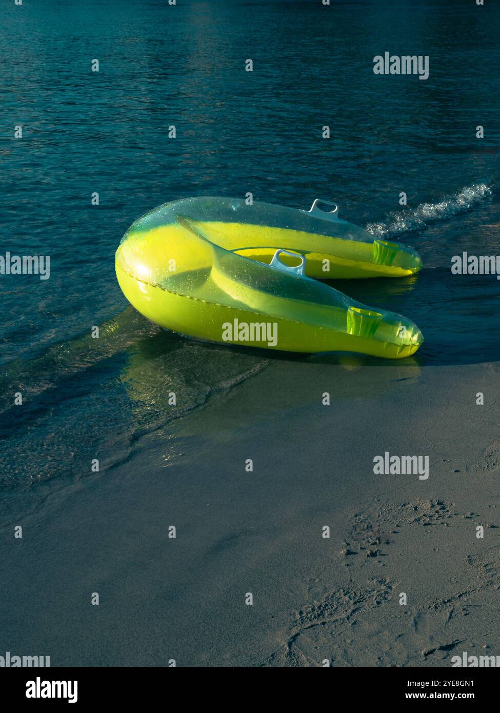 Inflatable on beach shore Stock Photo - Alamy