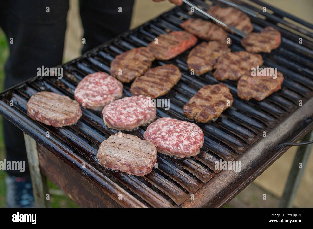 Meat is being grilled on a barbecue.Mangal concept Stock Photo - Alamy