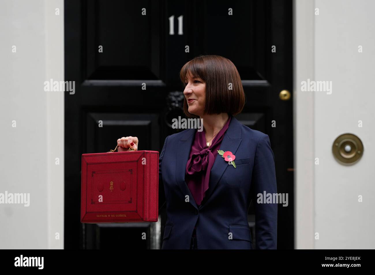 Britain's Chancellor of the Exchequer, Rachel Reeves, holds up the ...