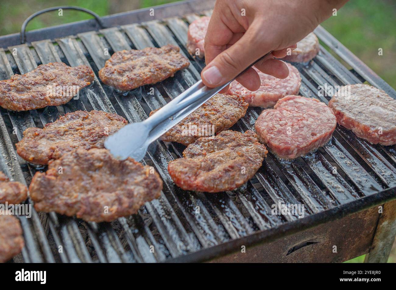 Meat is being grilled on a barbecue.Mangal concept Stock Photo - Alamy