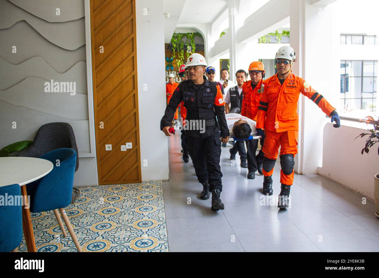 Joint officers carry a man roleplaying as an injured victim during an ...