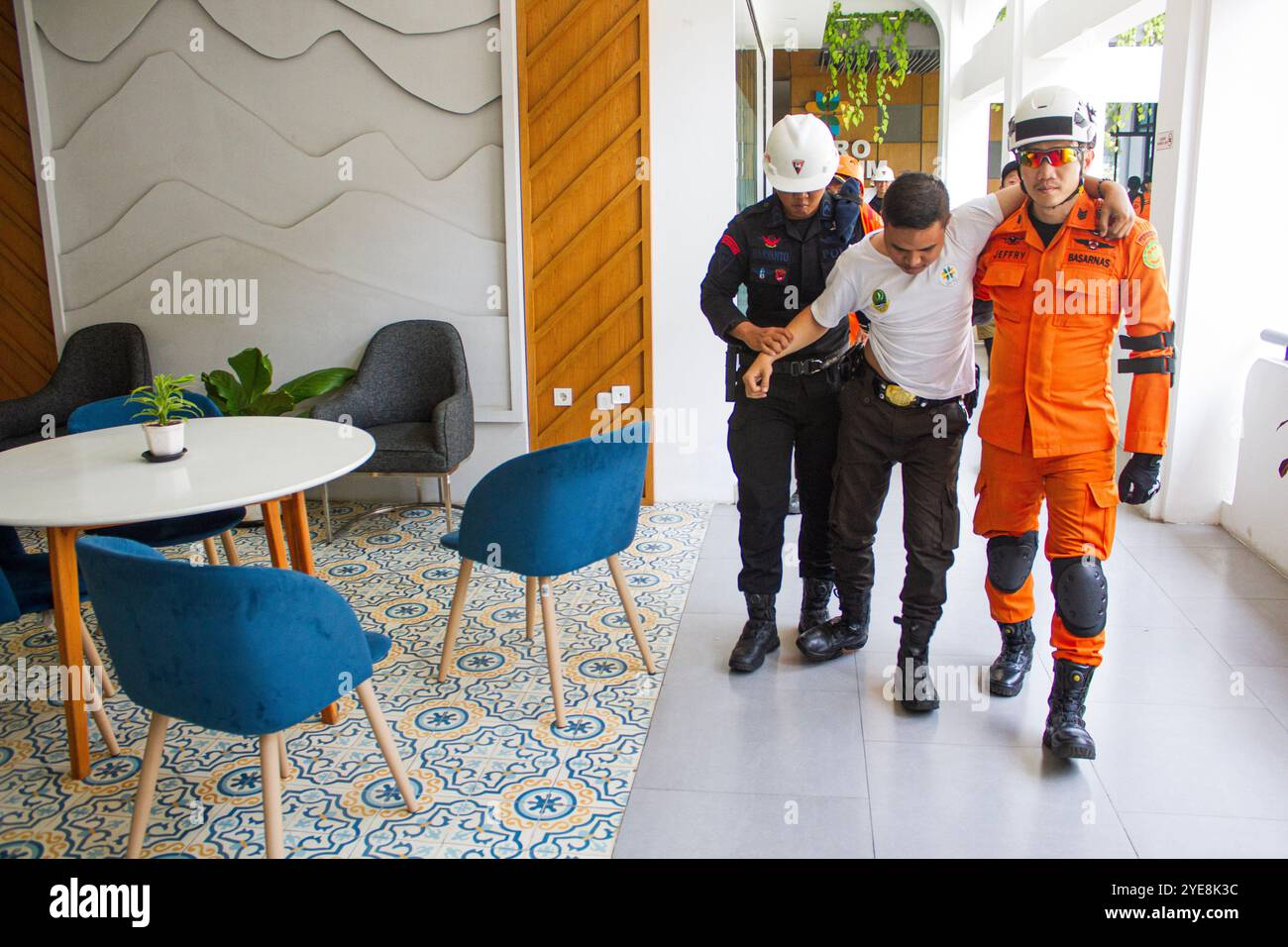 Joint officers help a man roleplaying as an injured victim during an ...