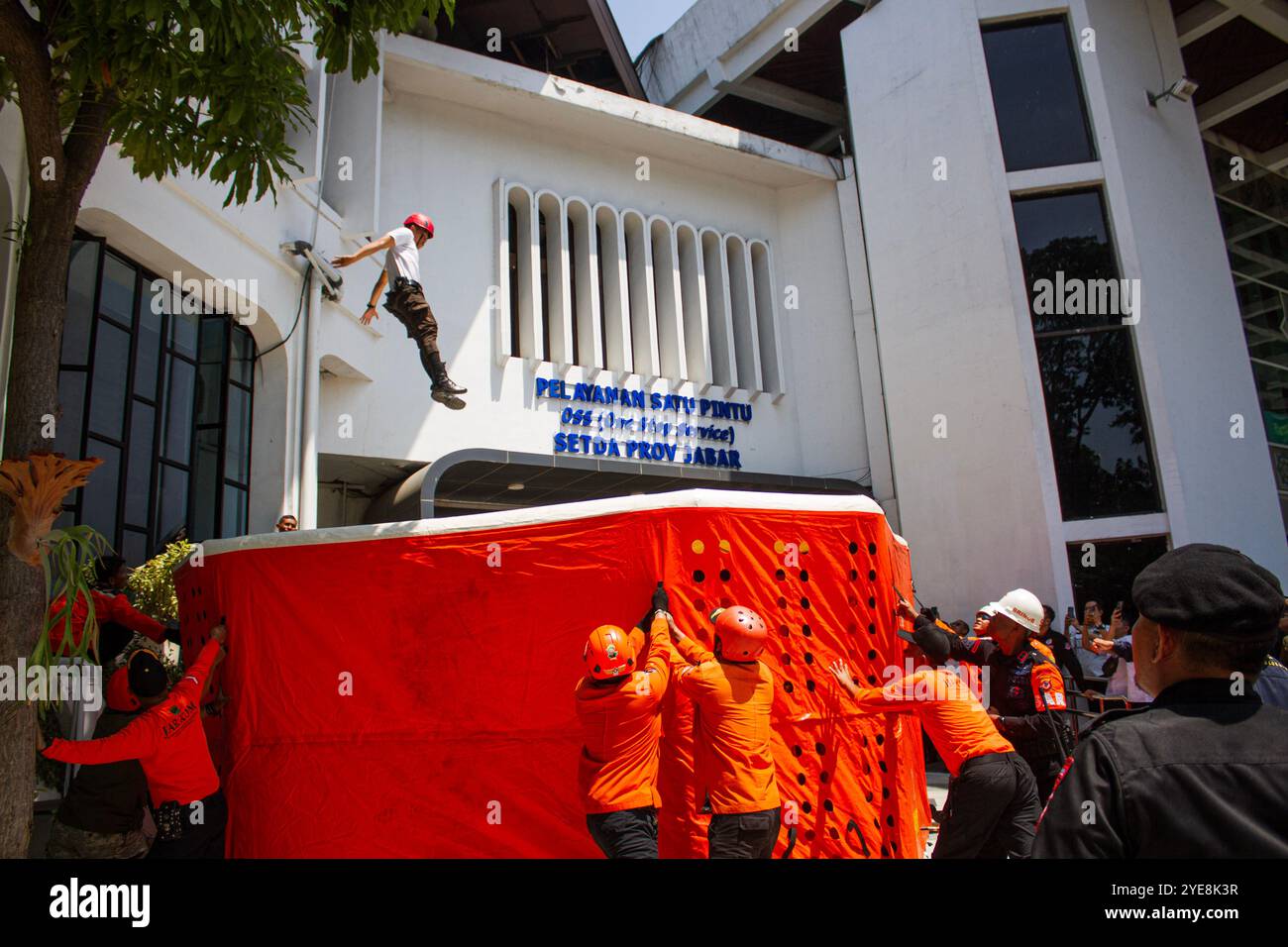 People take a part in an earthquake drill for disaster risk reduction ...