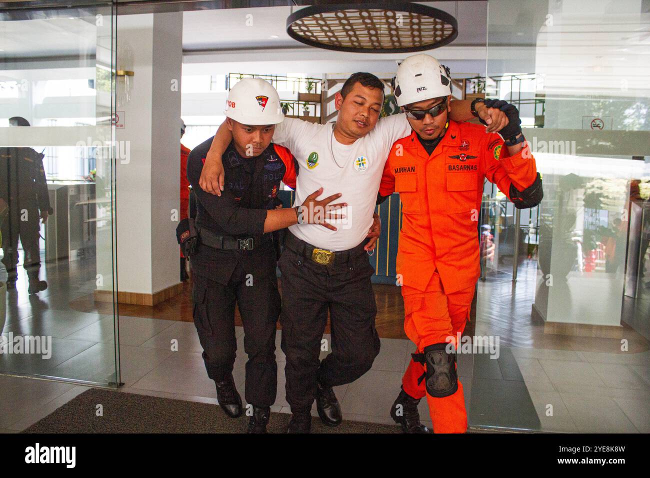 Joint officers help a man roleplaying as an injured victim during an ...
