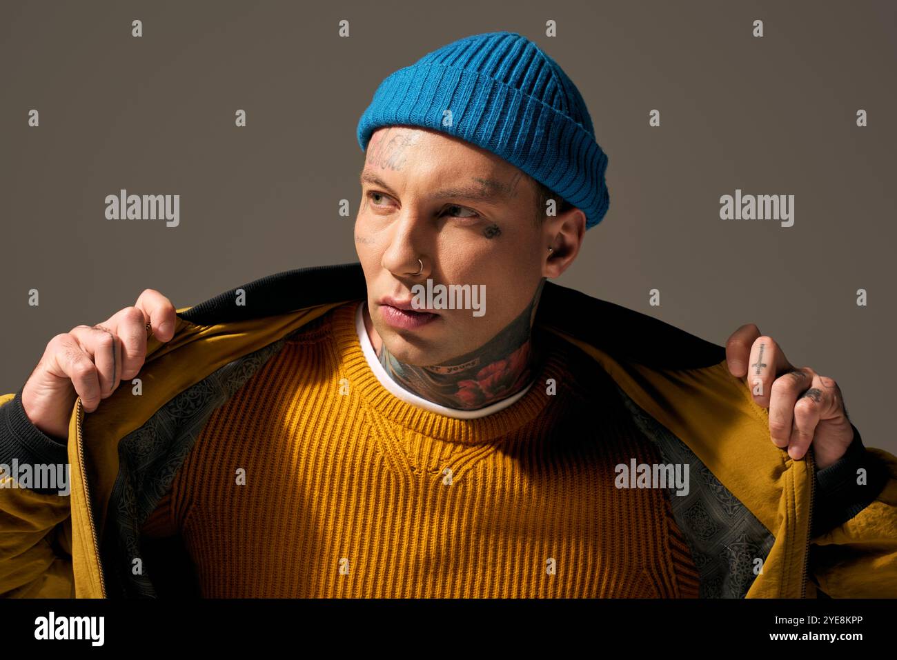 A stylish young man wearing a beanie reveals his vibrant personality ...