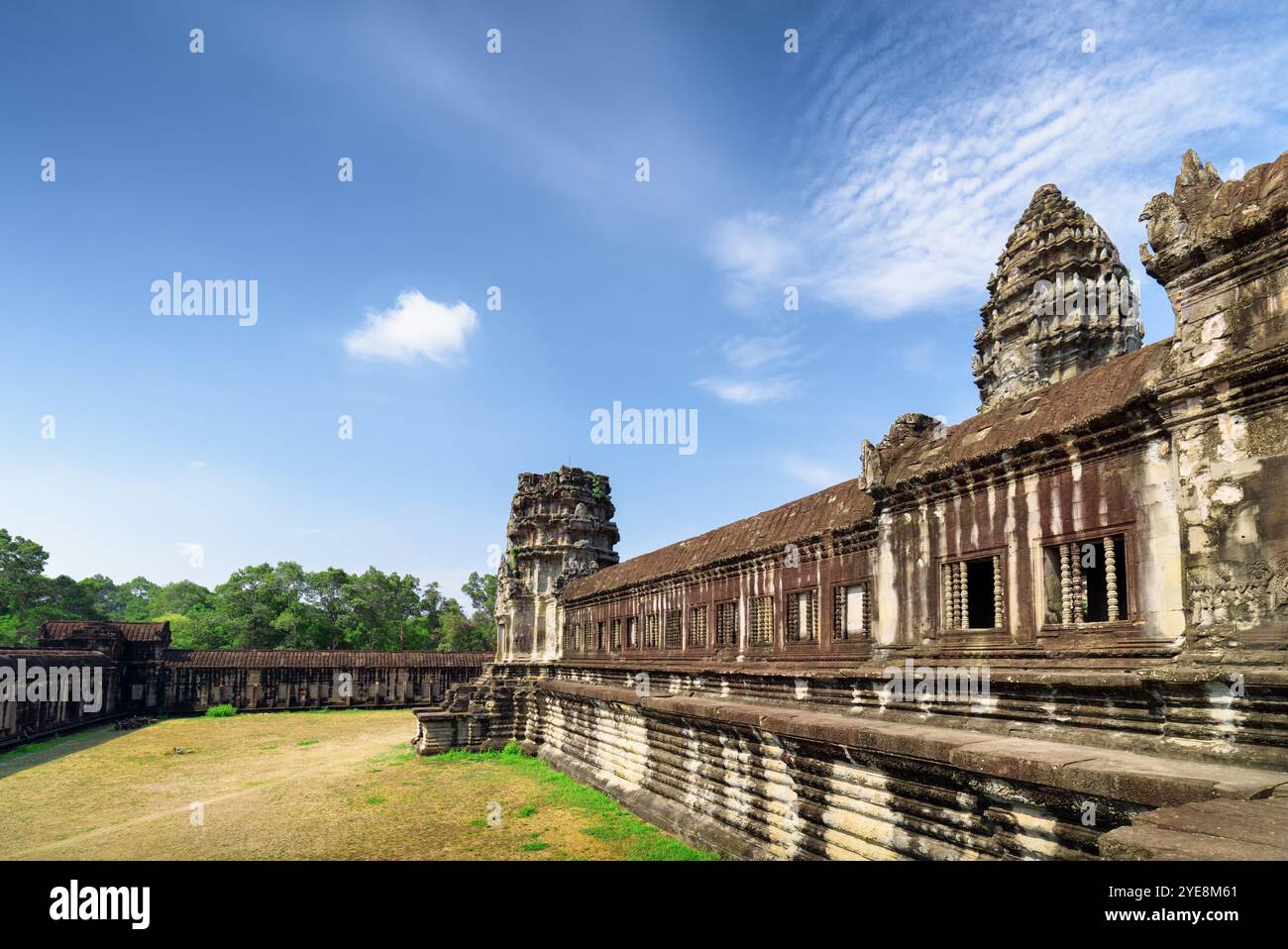 Wall of gallery and one of towers ancient Angkor Wat, Cambodia Stock ...