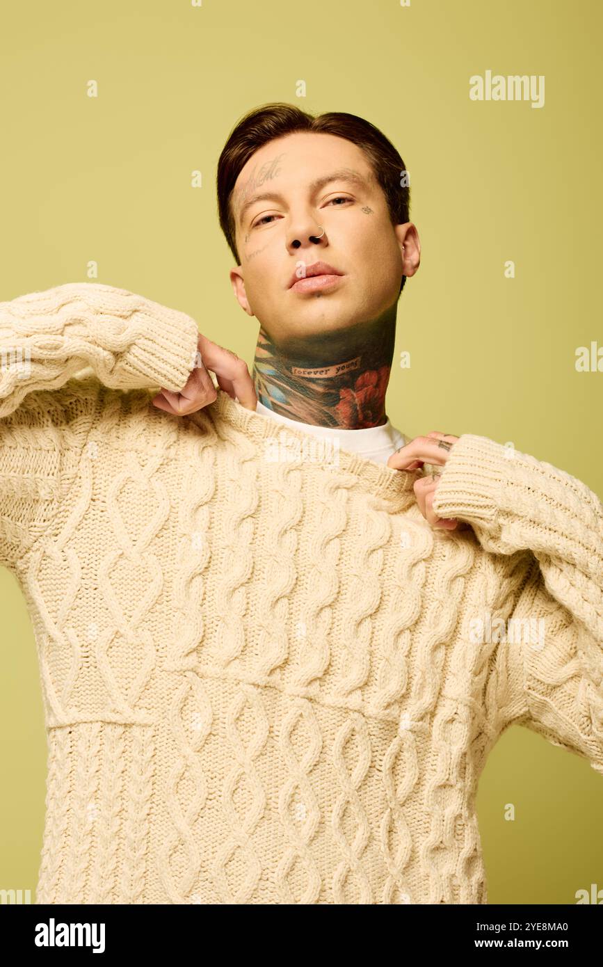 A young man with striking tattoos showcases his unique style while ...