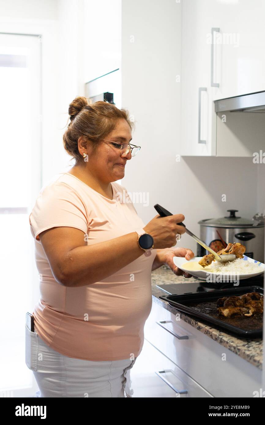 Hispanic woman serving traditional hi-res stock photography and images ...