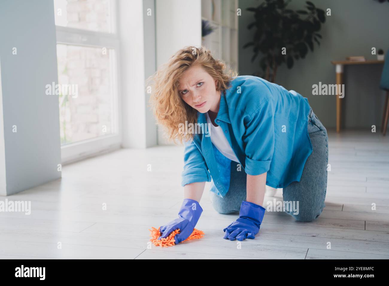 Full length photo of lovely young ginger girl wipe floor kneel upset ...