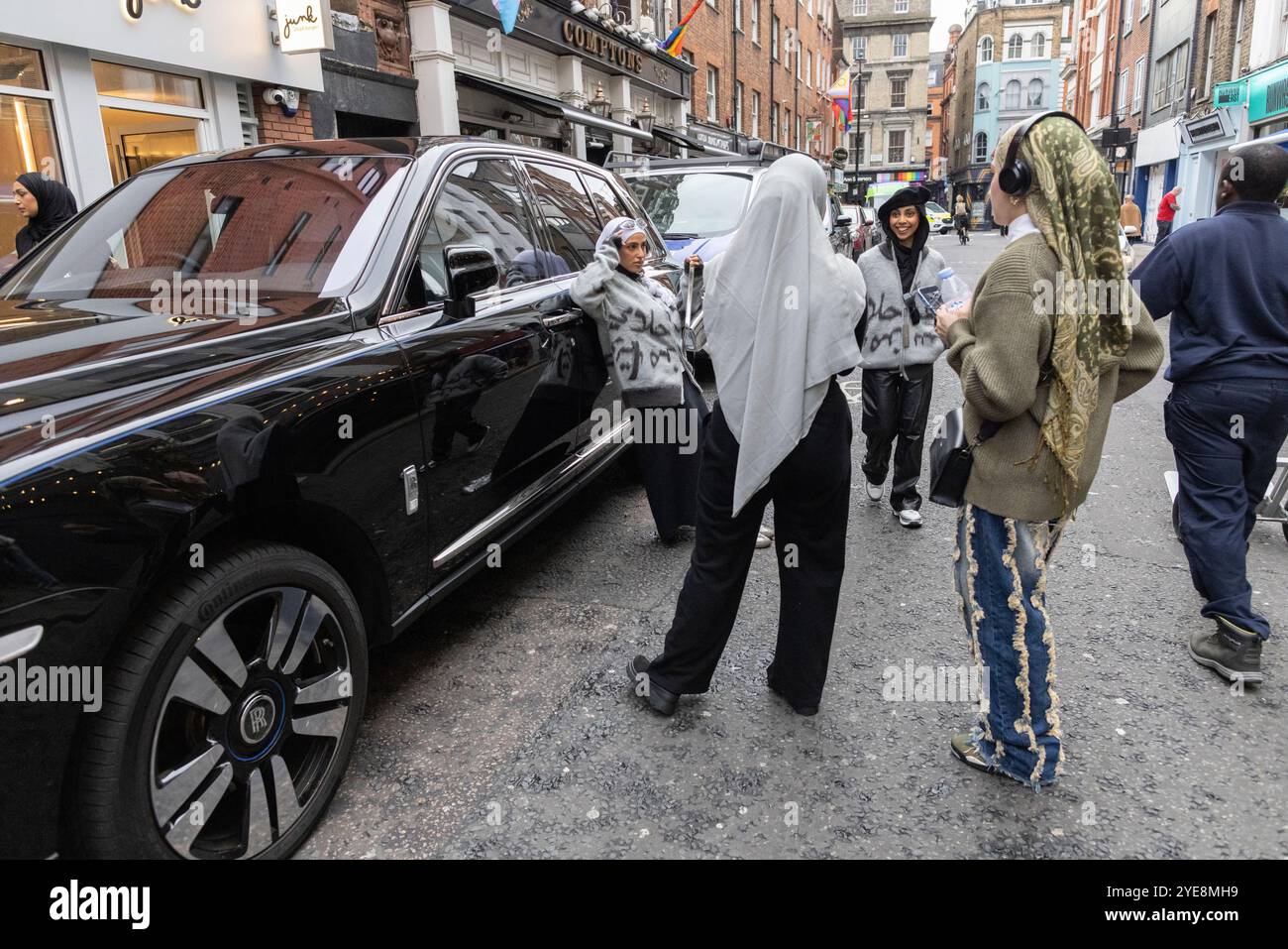 Middle eastern tourists take selfie's outside their luxury vehicle ...