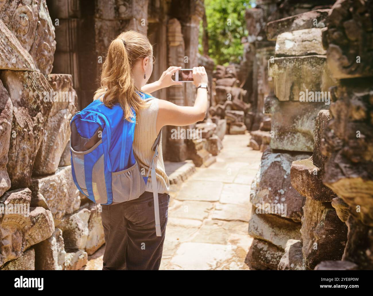 Tourist photographing the temple in Angkor, Cambodia Stock Photo - Alamy
