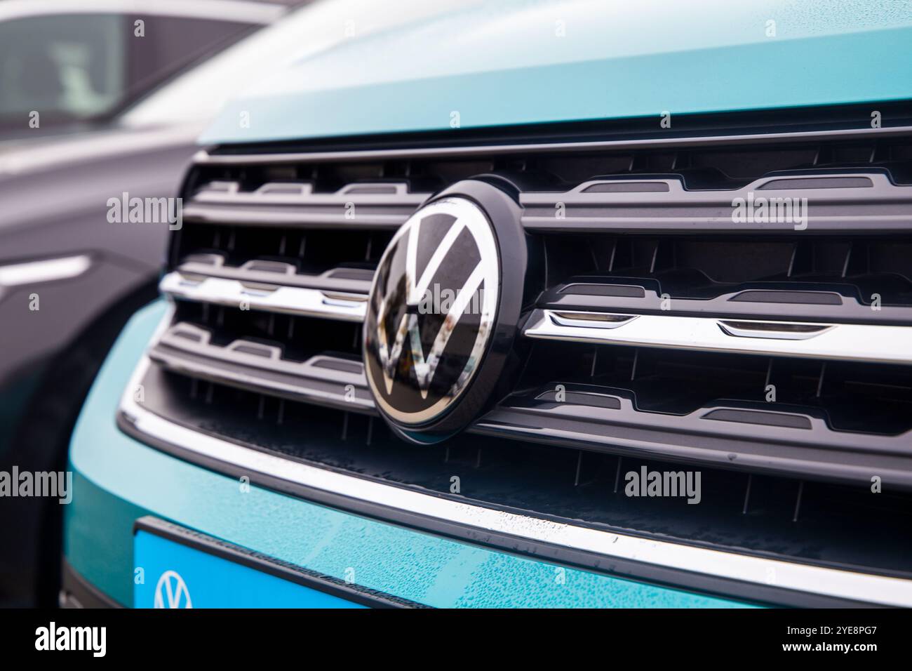Close-up of vehicles from the car manufacturer VW in a car dealership ...