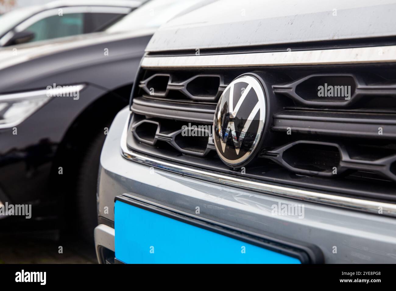 Close-up of vehicles from the car manufacturer VW in a car dealership ...