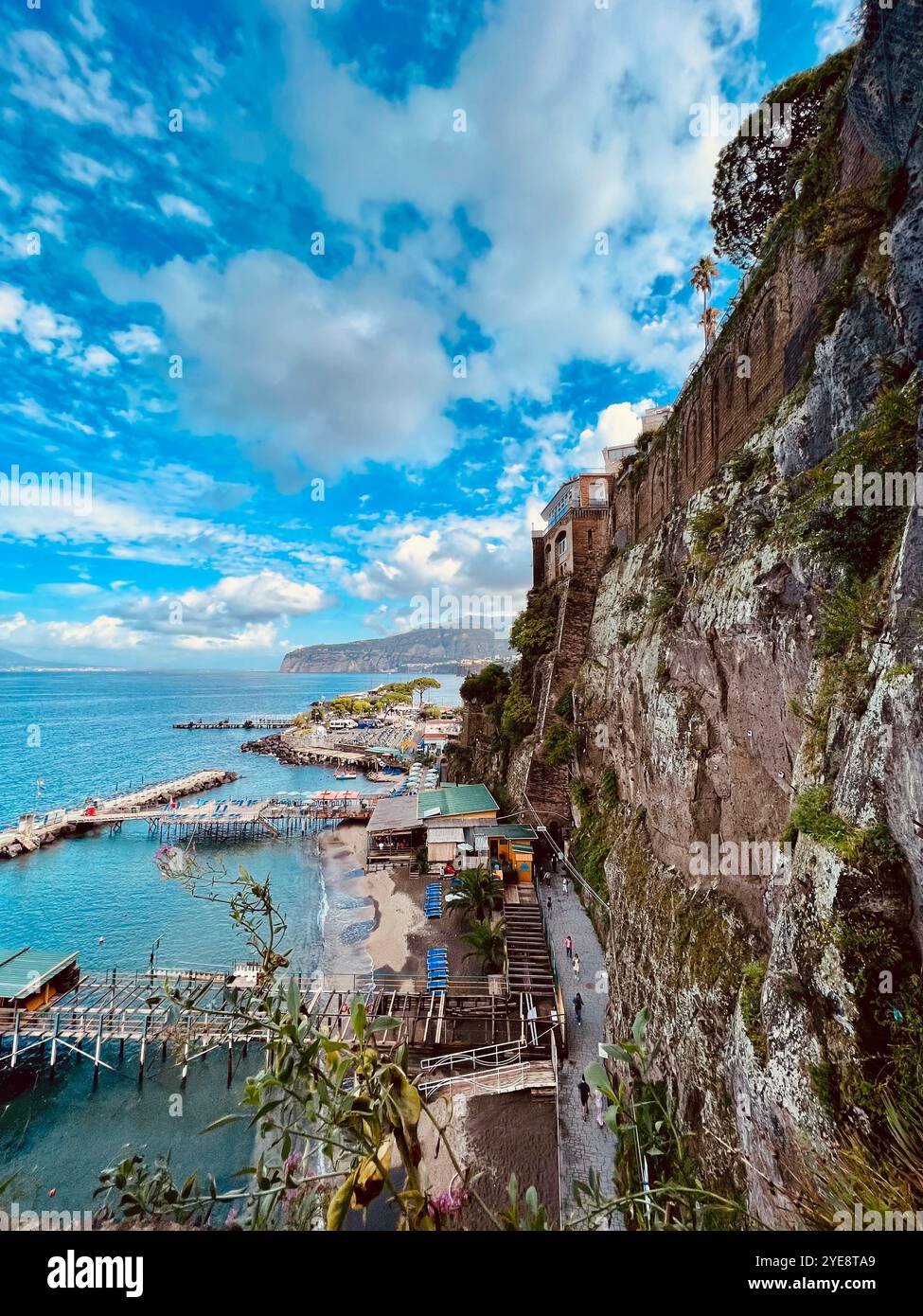 Cliffside next to the dark blue sea at the amlfi coast in italy ...