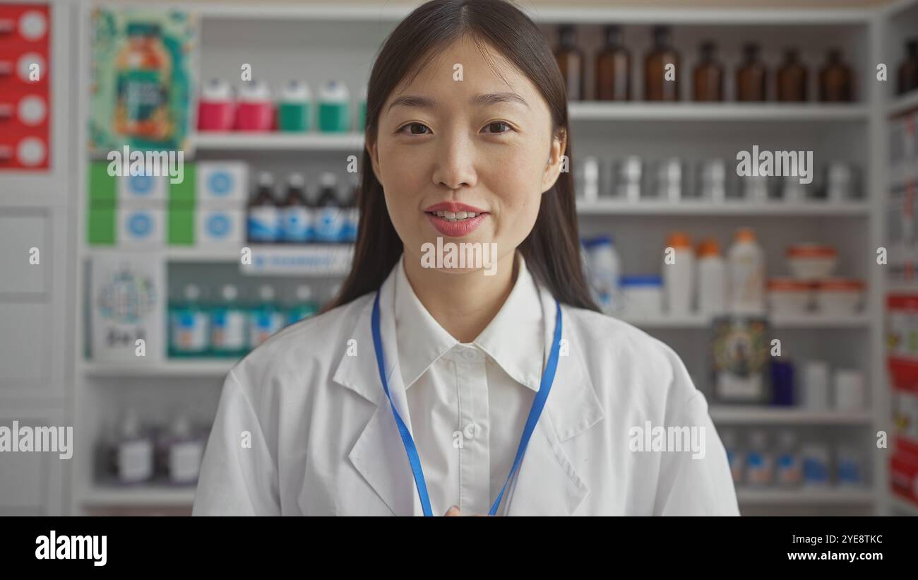 Chinese pharmacist woman wearing lab coat posing professionally in ...