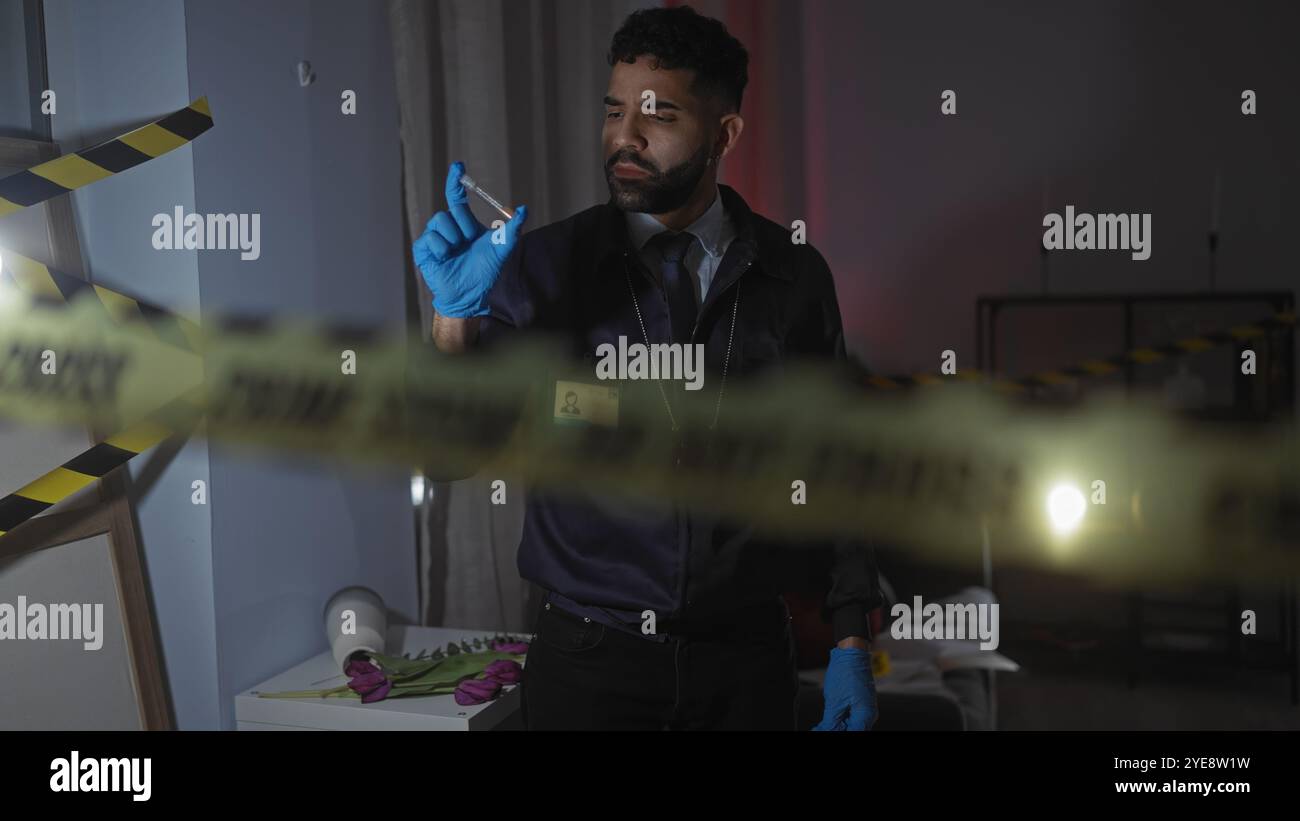 A hispanic man evaluates evidence at an indoor crime scene with caution ...