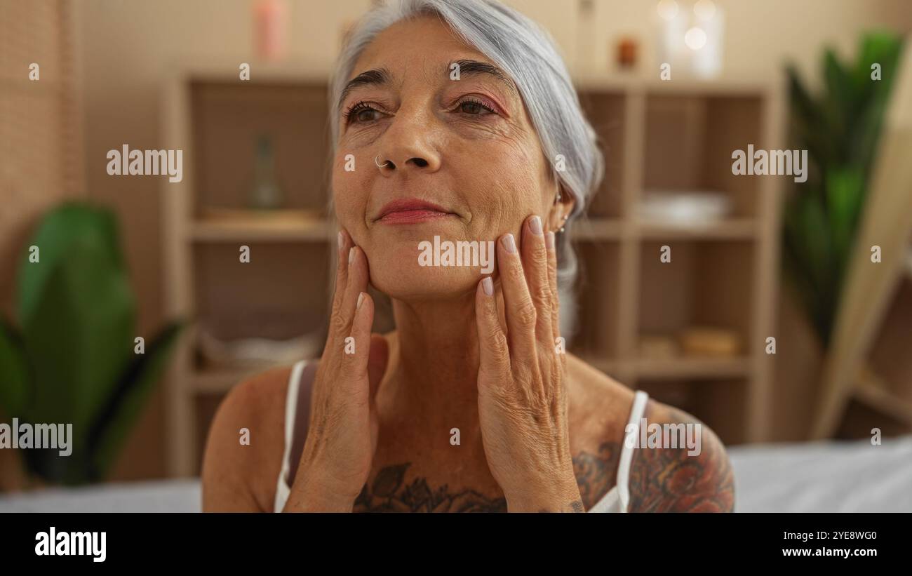 Mature woman enjoying a relaxing facial treatment in a serene spa room ...